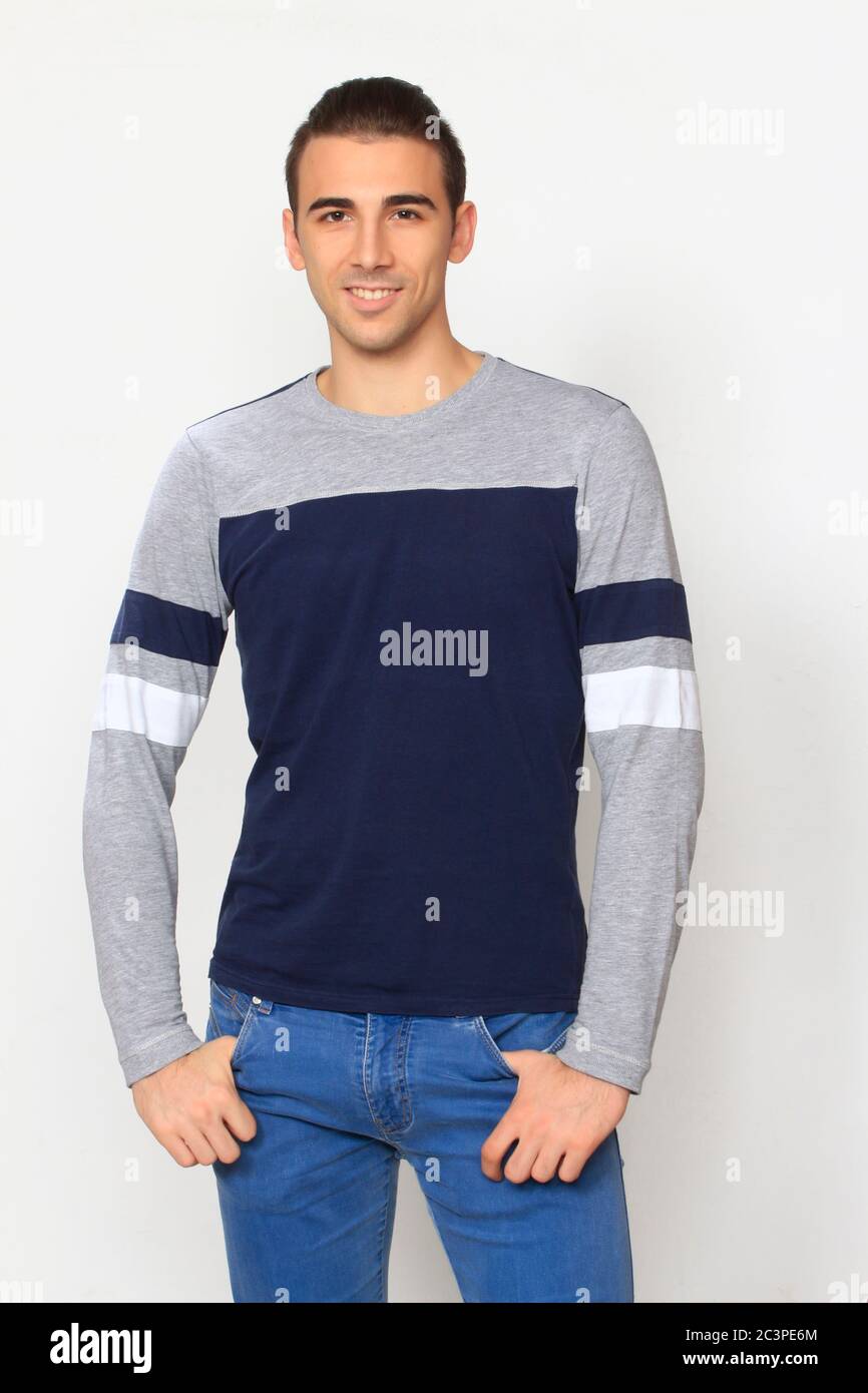 Attractive male model with short hair posing in studio on isolated ...