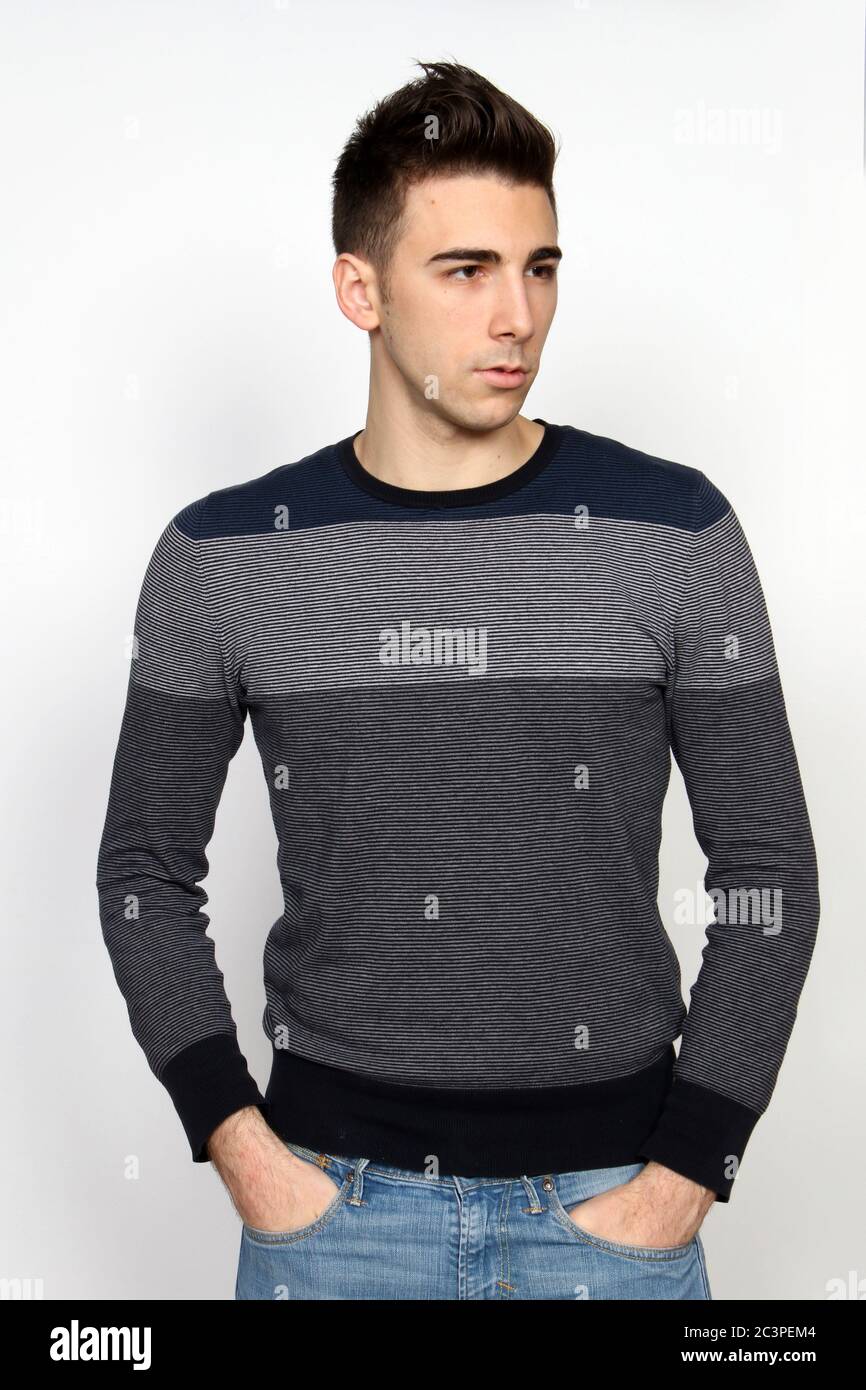 Attractive male model with short hair posing in studio on isolated ...