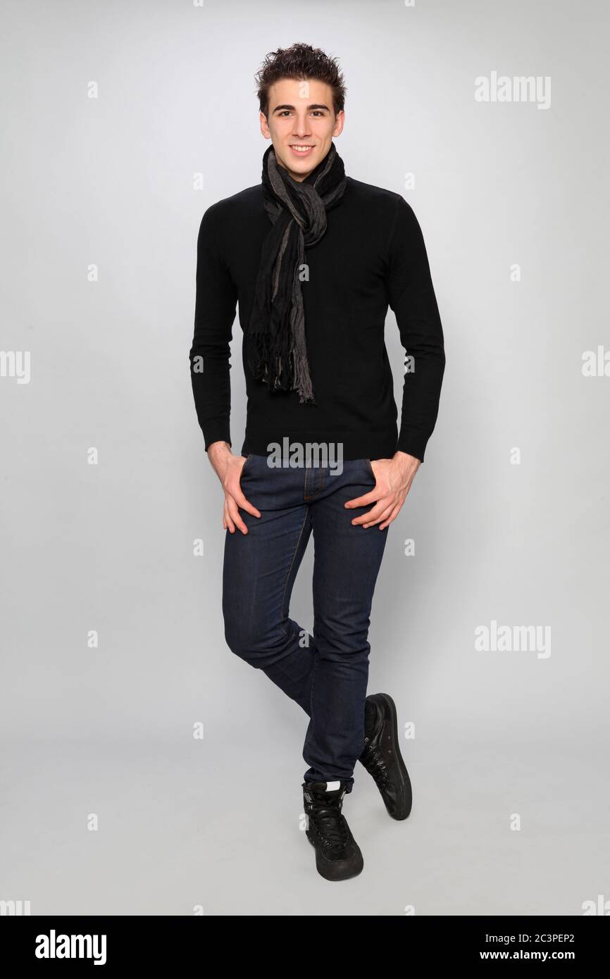 Attractive male model with short hair posing in studio on isolated ...