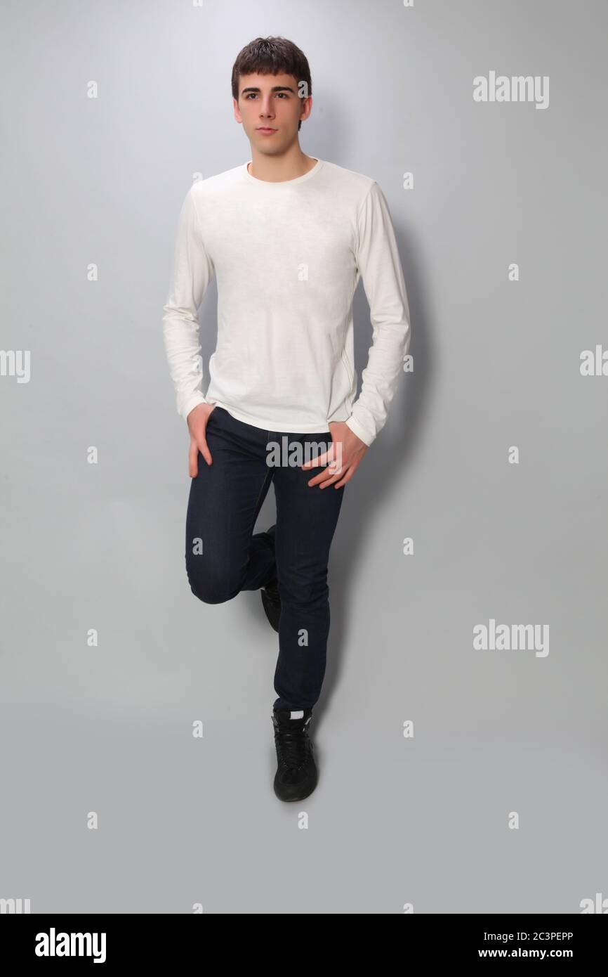 Attractive male model with short hair posing in studio on isolated ...