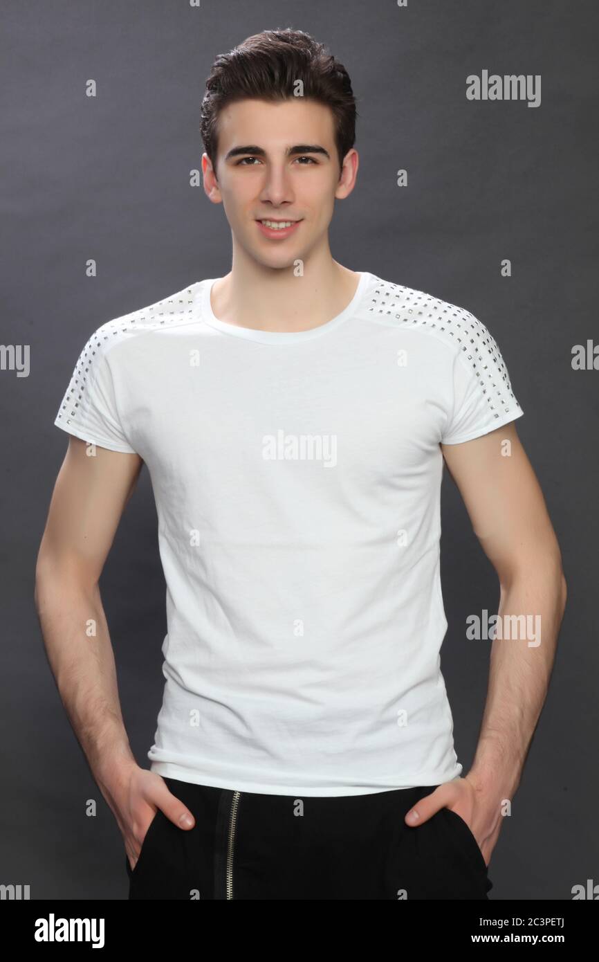 Attractive male model with short hair posing in studio on isolated ...