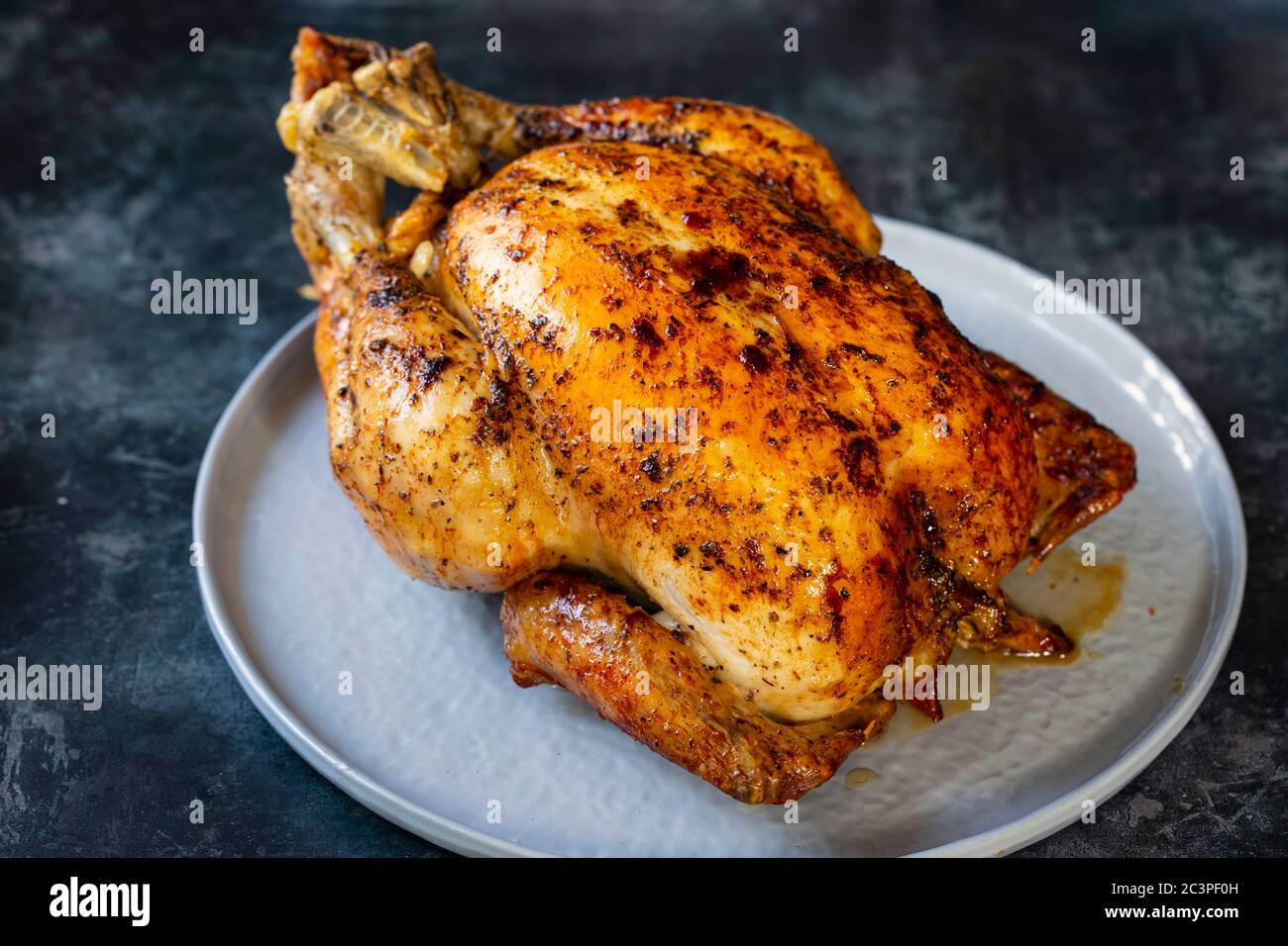 Whole roast chicken freshly from the oven Stock Photo - Alamy