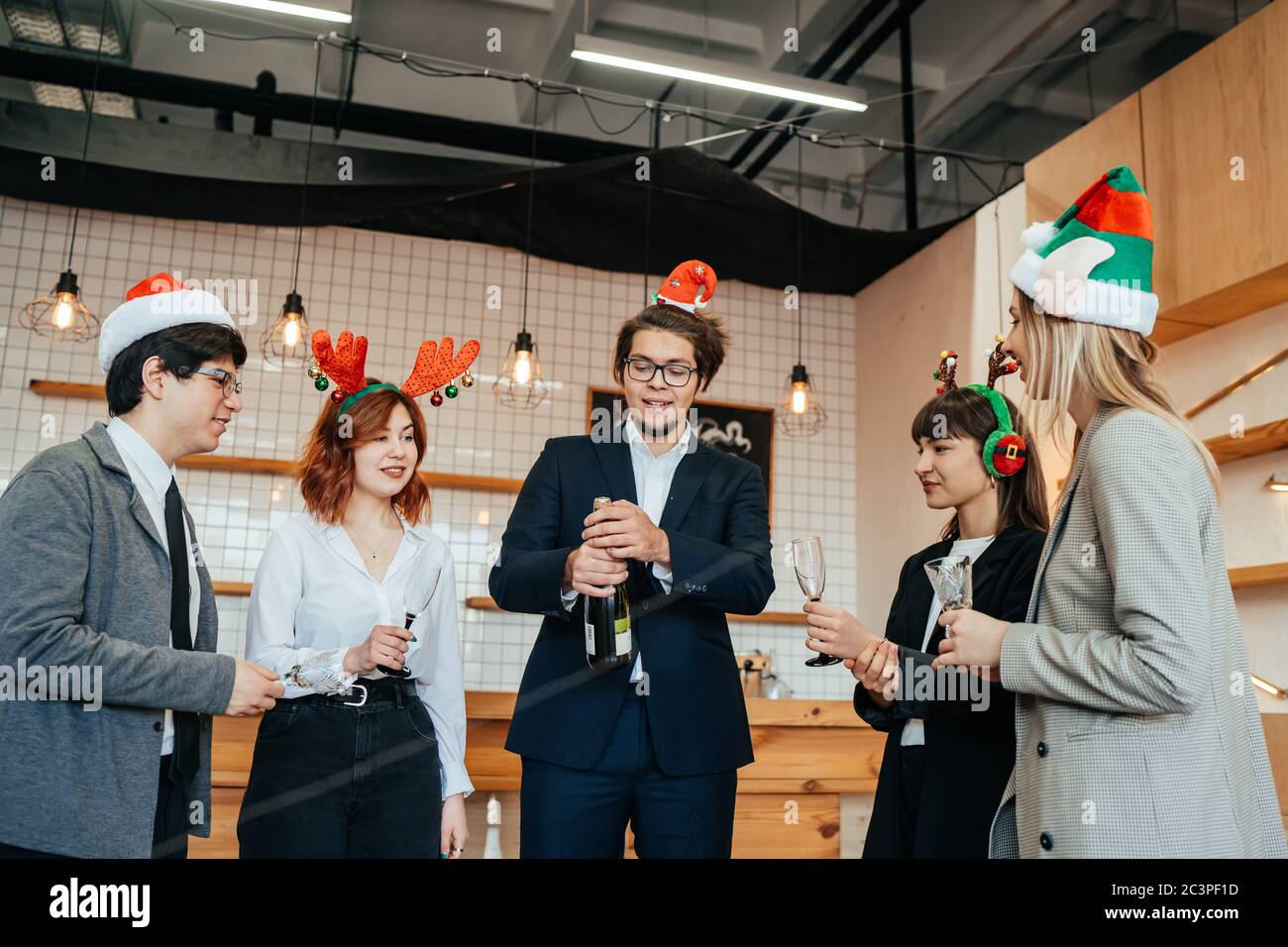 Happy colleagues in office celebrate special event Stock Photo - Alamy