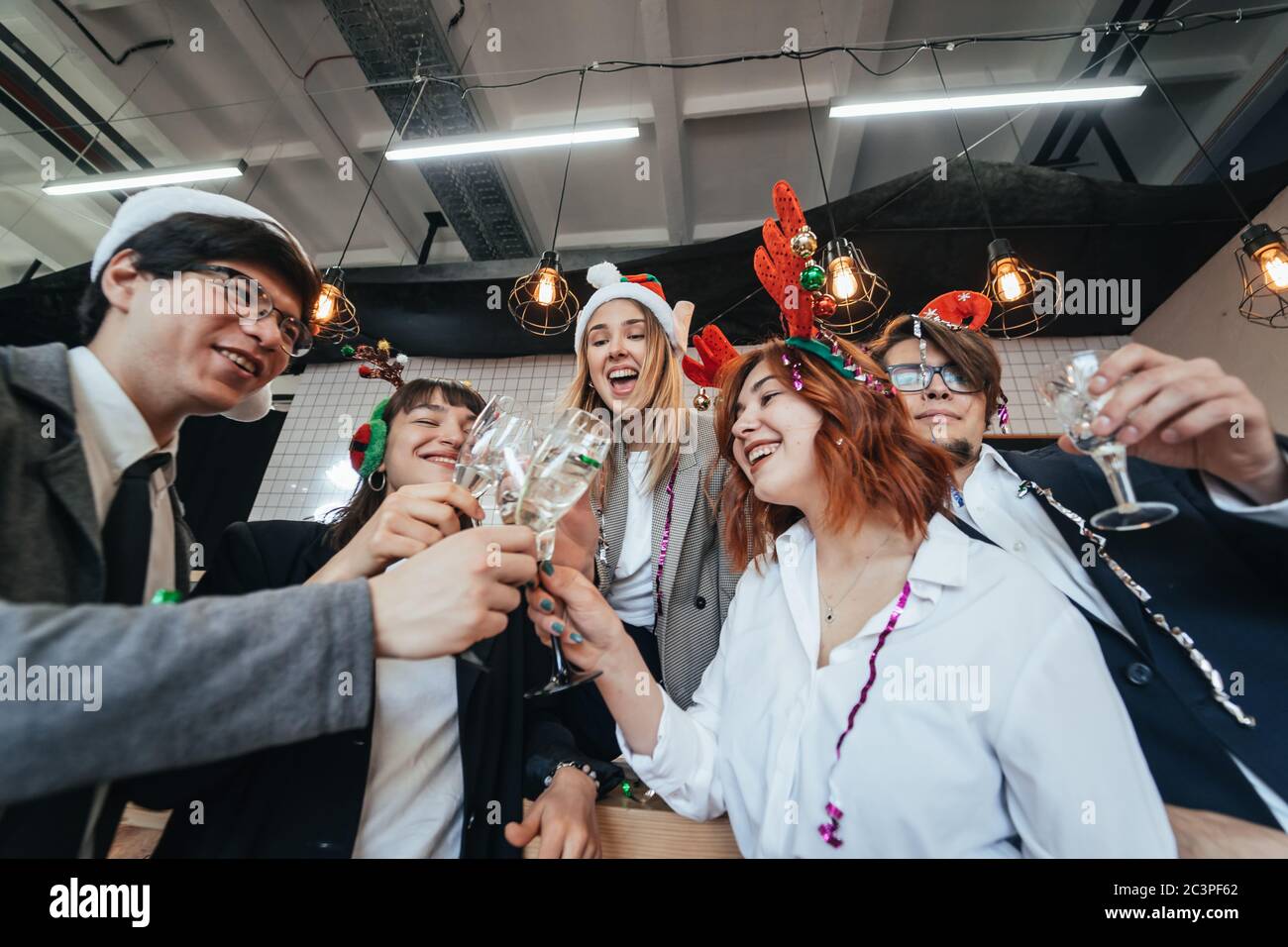 Happy colleagues in office celebrate special event Stock Photo - Alamy