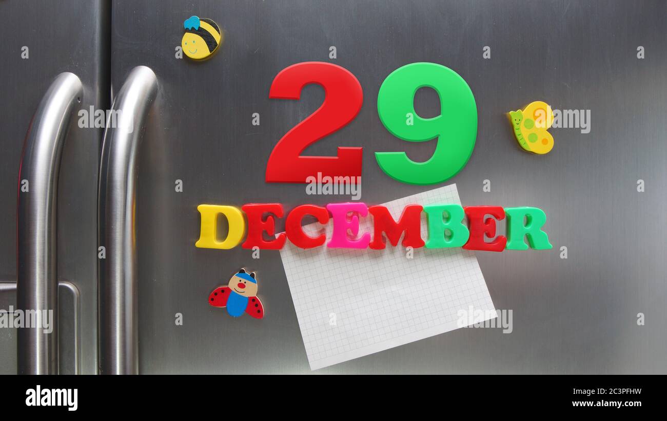 December 29 calendar date made with plastic magnetic letters holding a ...