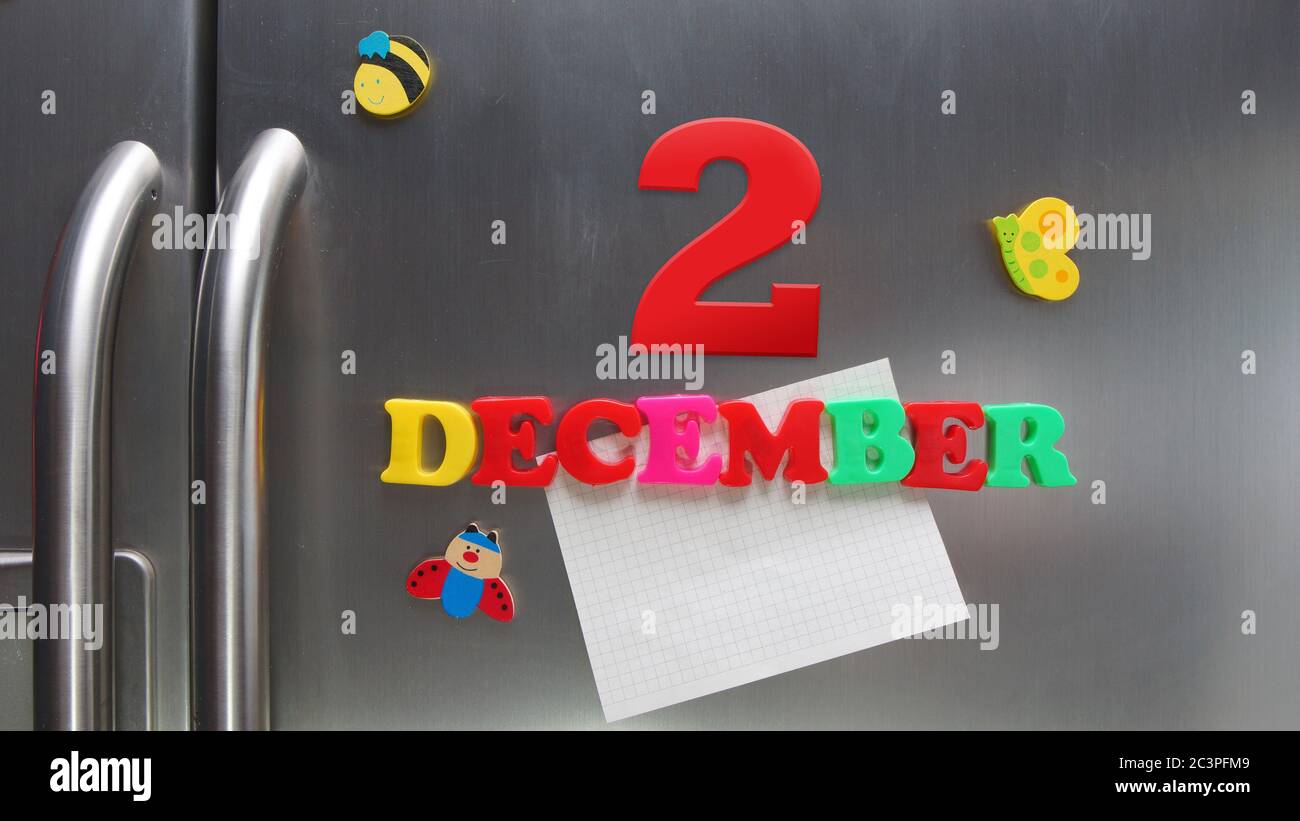 December 2 calendar date made with plastic magnetic letters holding a ...