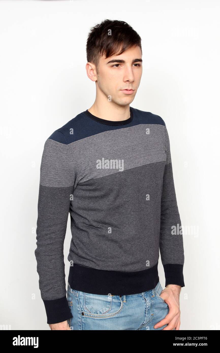 Attractive male model with short hair posing in studio on isolated ...