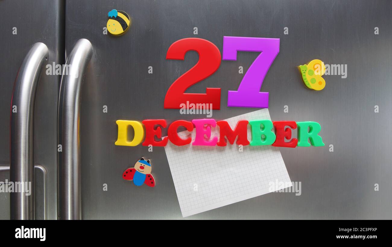 December 27 calendar date made with plastic magnetic letters holding a ...