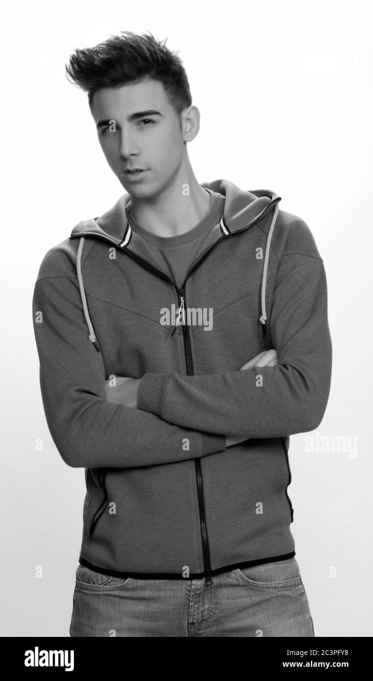 Attractive male model with short hair posing in studio on isolated ...