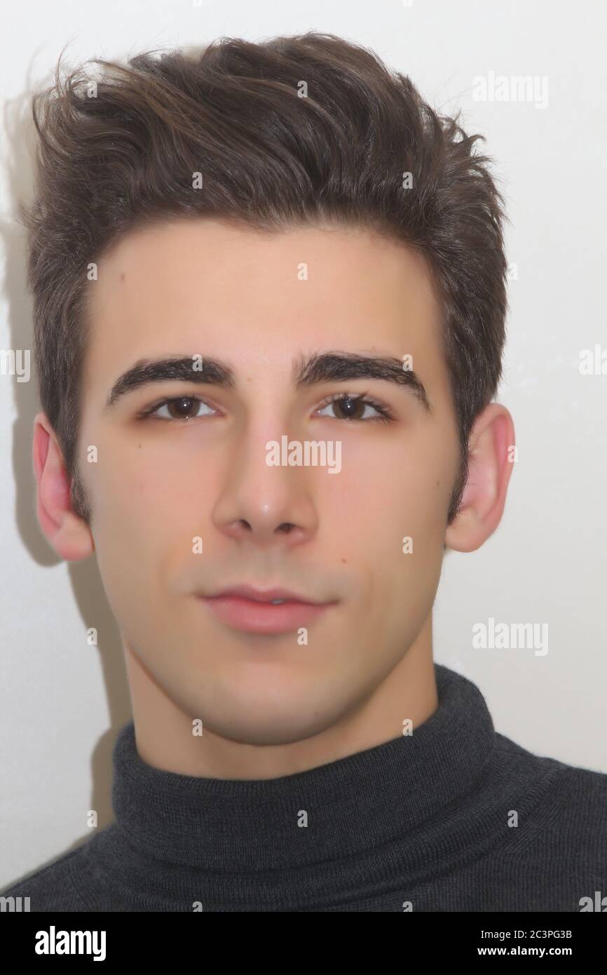 Attractive male model with short hair posing in studio on isolated ...