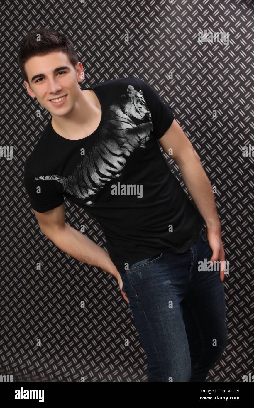 Attractive male model with short hair posing in studio on isolated ...