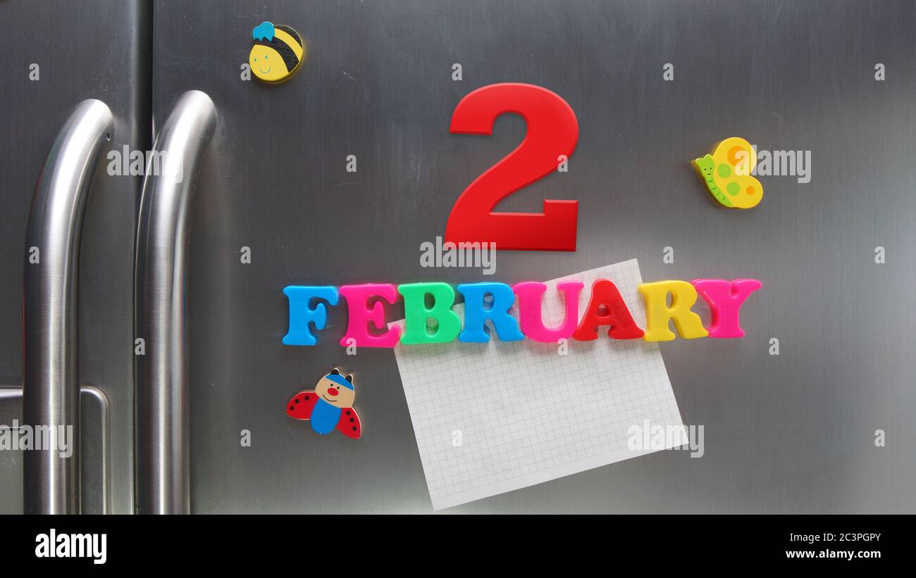February 2 calendar date made with plastic magnetic letters holding a ...