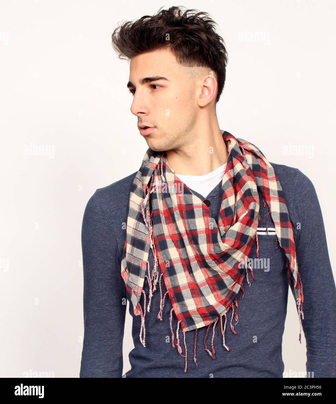 Attractive male model with short hair posing in studio on isolated ...