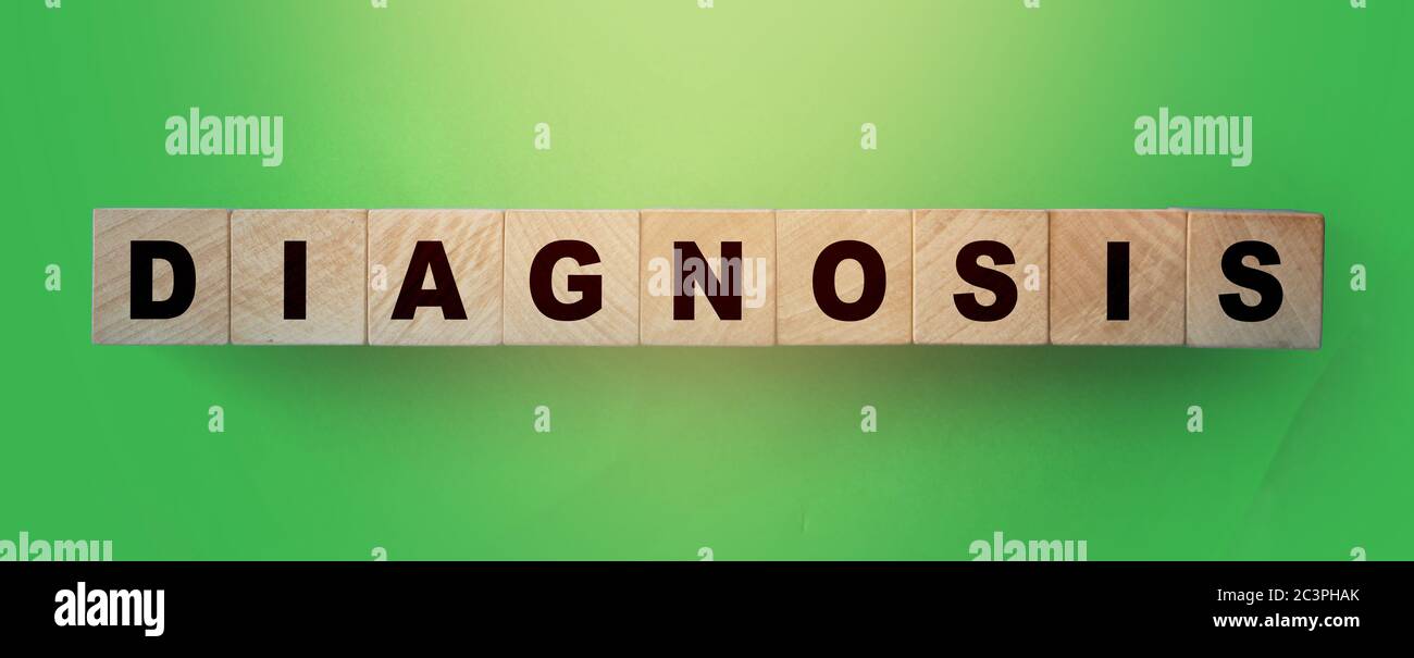 DIAGNOSIS - words from wooden blocks with letters on green background ...