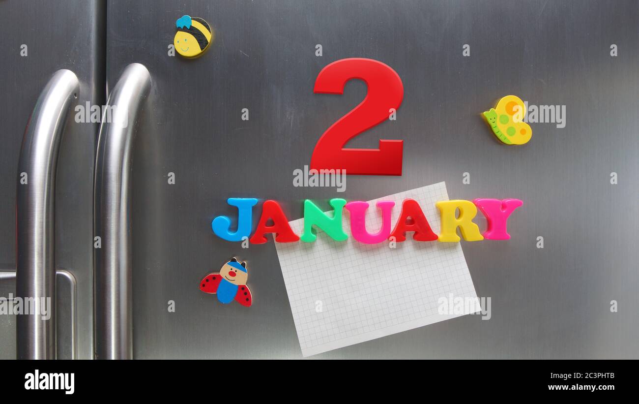 January 2 calendar date made with plastic magnetic letters holding a ...