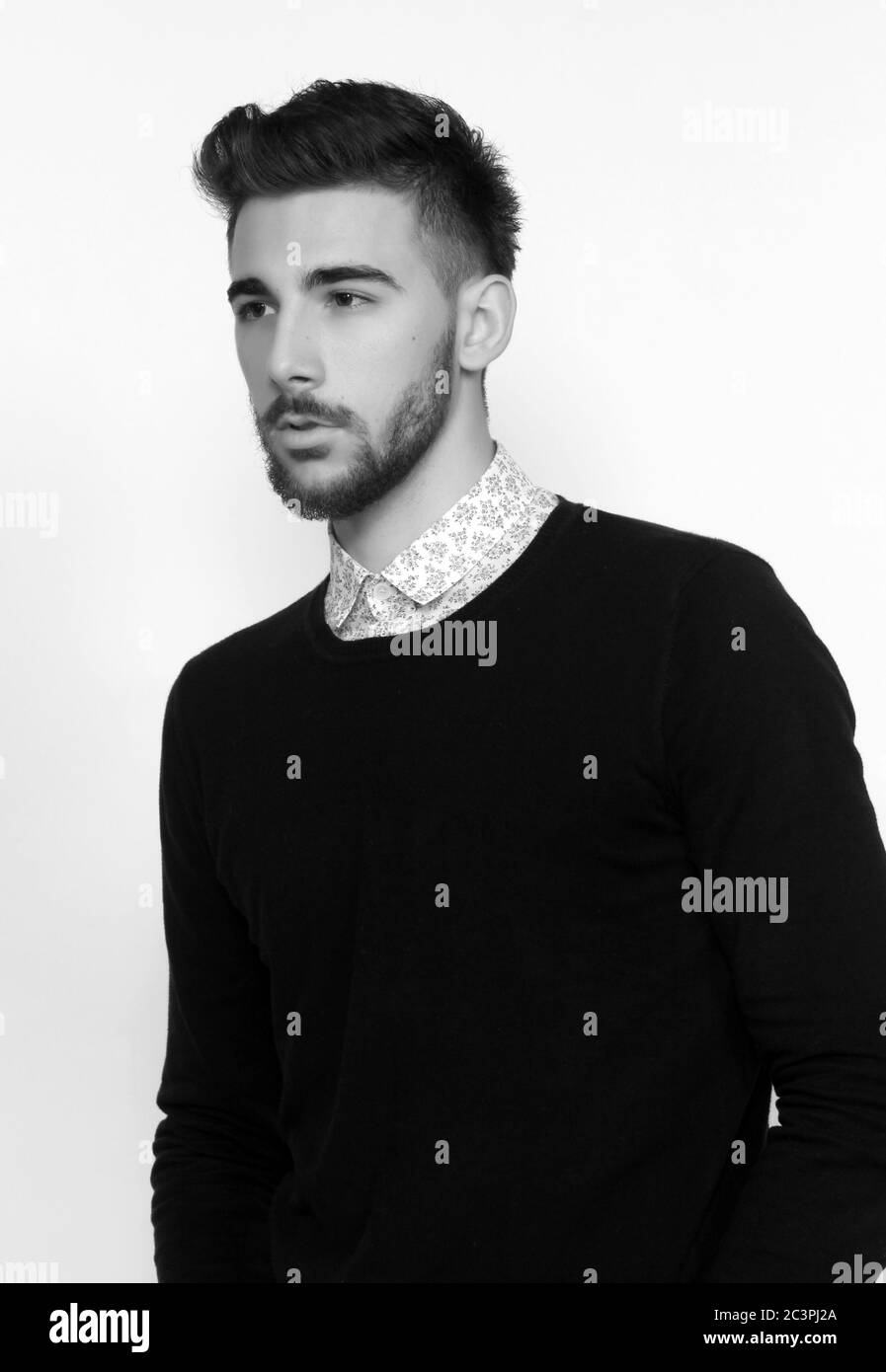 Attractive male model with short hair posing in studio on isolated ...