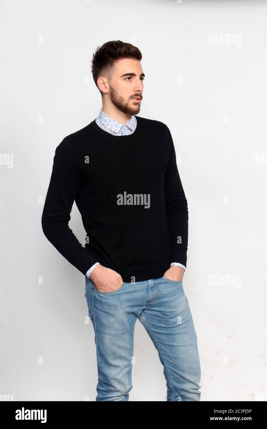 Attractive male model with short hair posing in studio on isolated ...