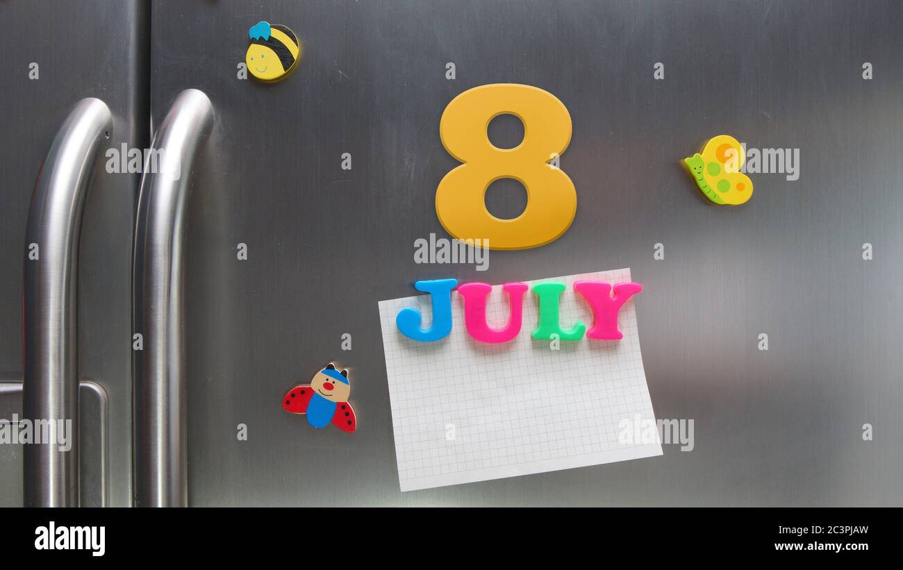 July 8 calendar date made with plastic magnetic letters holding a note ...