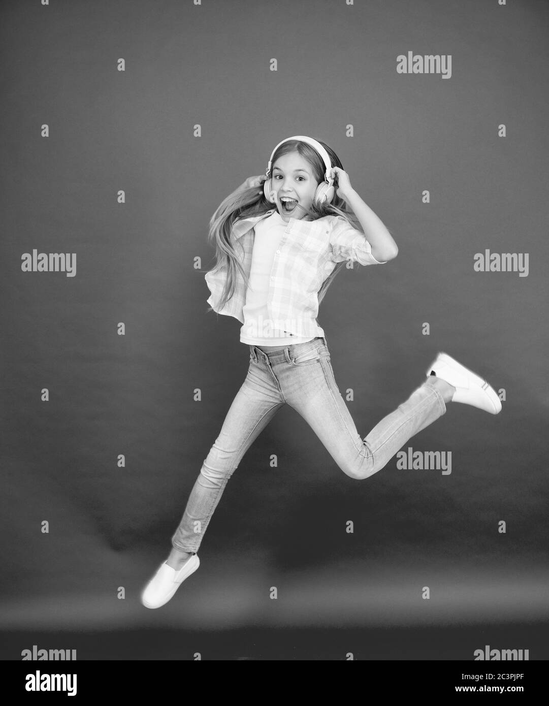 reach her dream. fly up in air. achievement. excited small girl wear ...