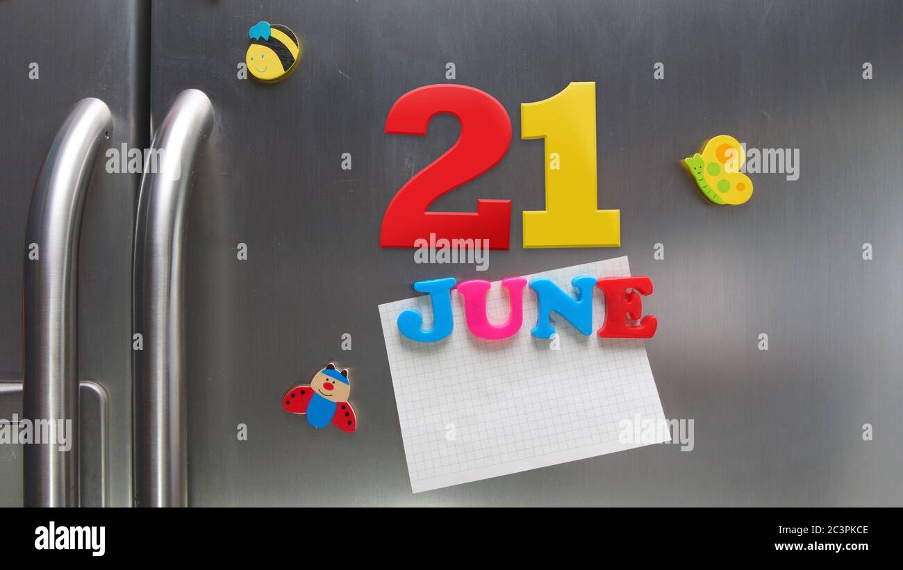 June 21 calendar date made with plastic magnetic letters holding a note ...