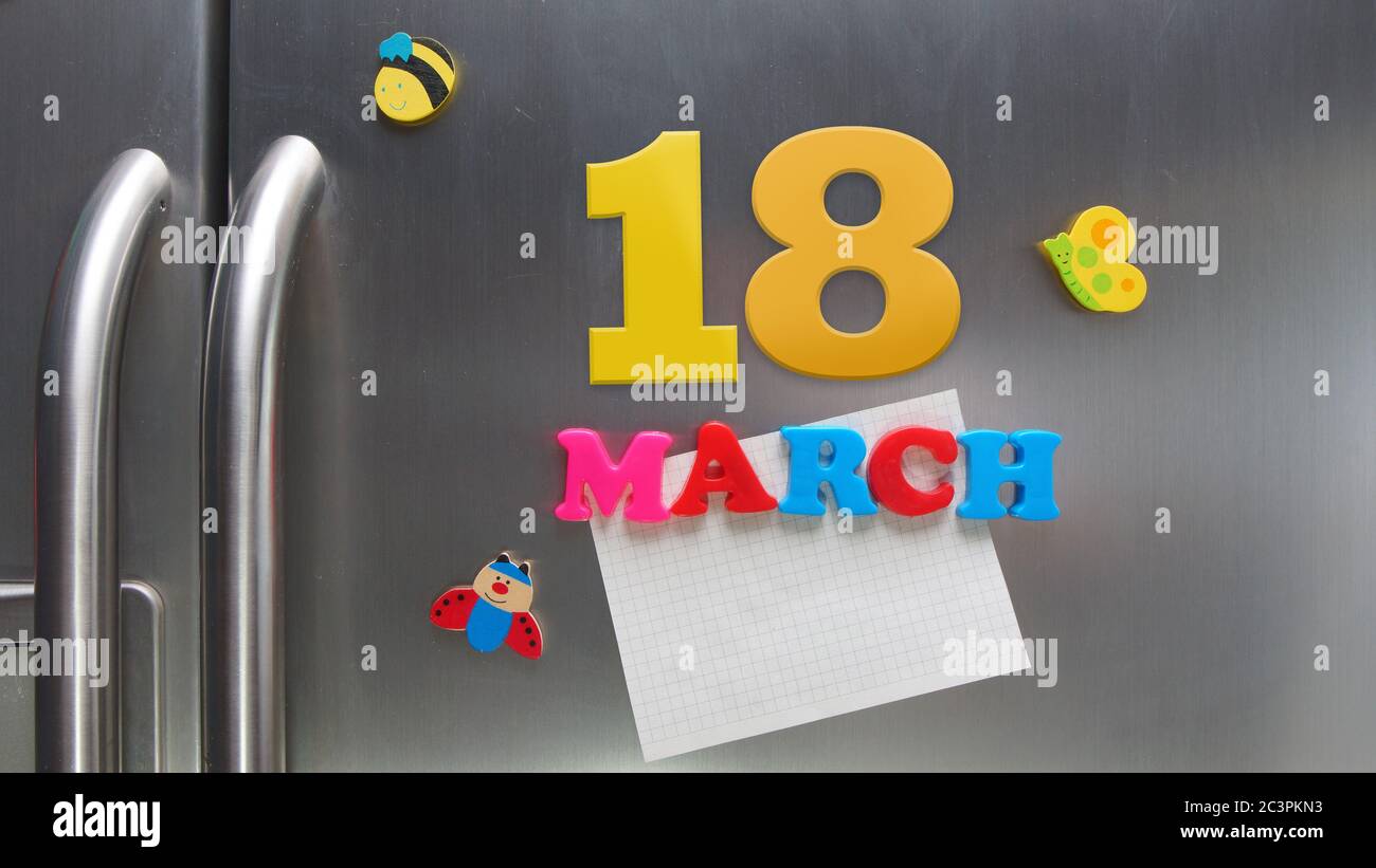 March 18 calendar date made with plastic magnetic letters holding a ...