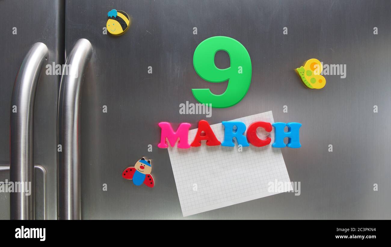 March 9 calendar date made with plastic magnetic letters holding a note ...