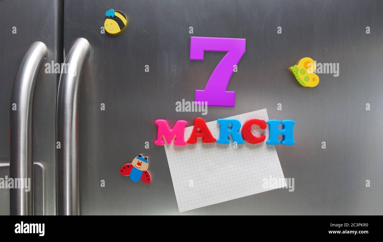 March 7 calendar date made with plastic magnetic letters holding a note ...