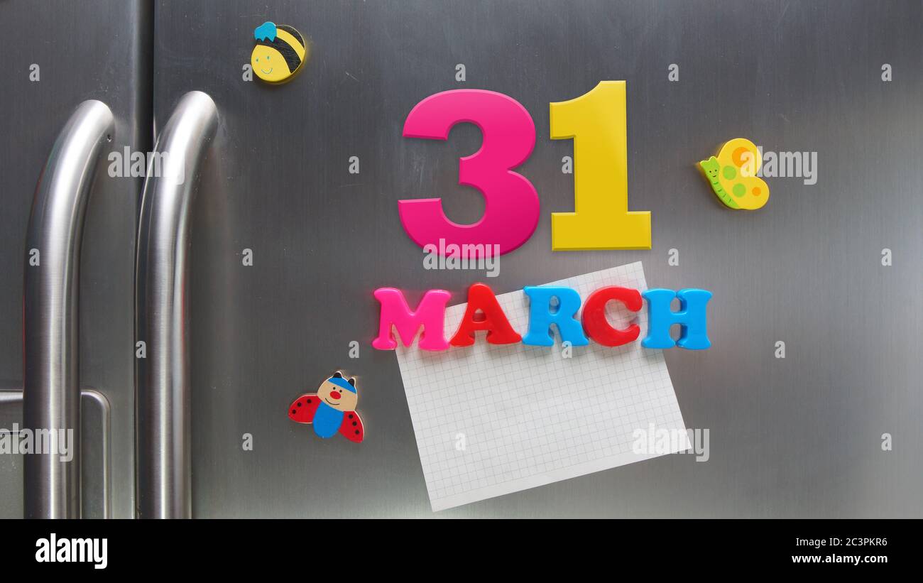 March 31 calendar date made with plastic magnetic letters holding a ...