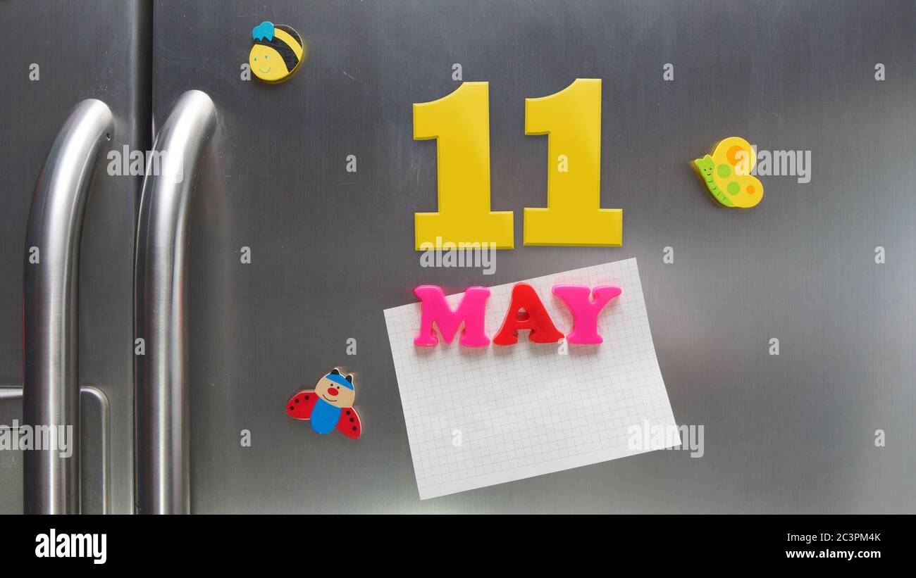 May 11 calendar date made with plastic magnetic letters holding a note ...