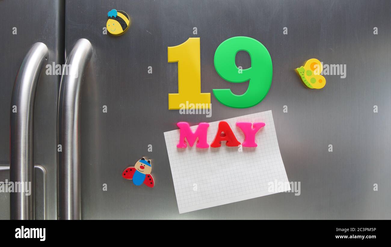 May 19 calendar date made with plastic magnetic letters holding a note ...
