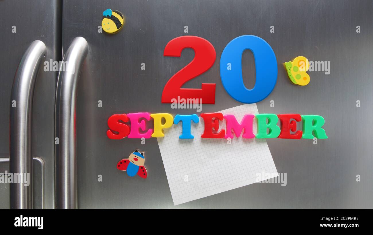 September 20 calendar date made with plastic magnetic letters holding a ...