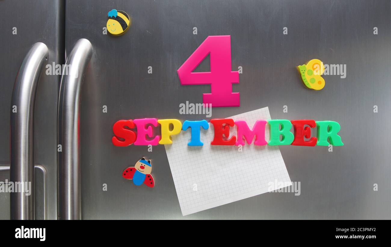 September 4 calendar date made with plastic magnetic letters holding a ...