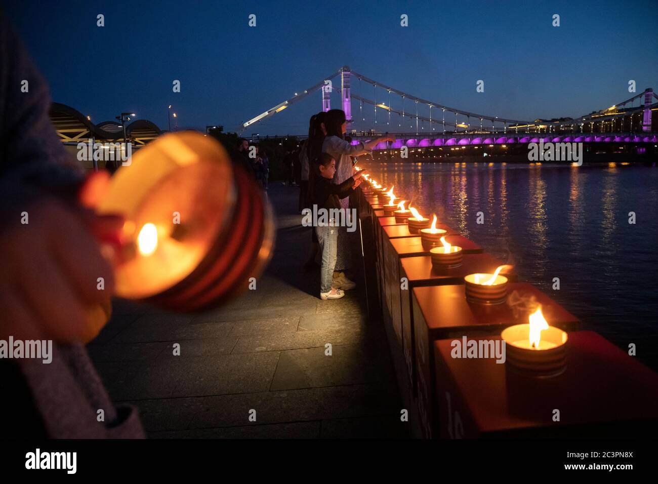 Moscow, Russia. 21st of June, 2020 People light candles during The Line ...