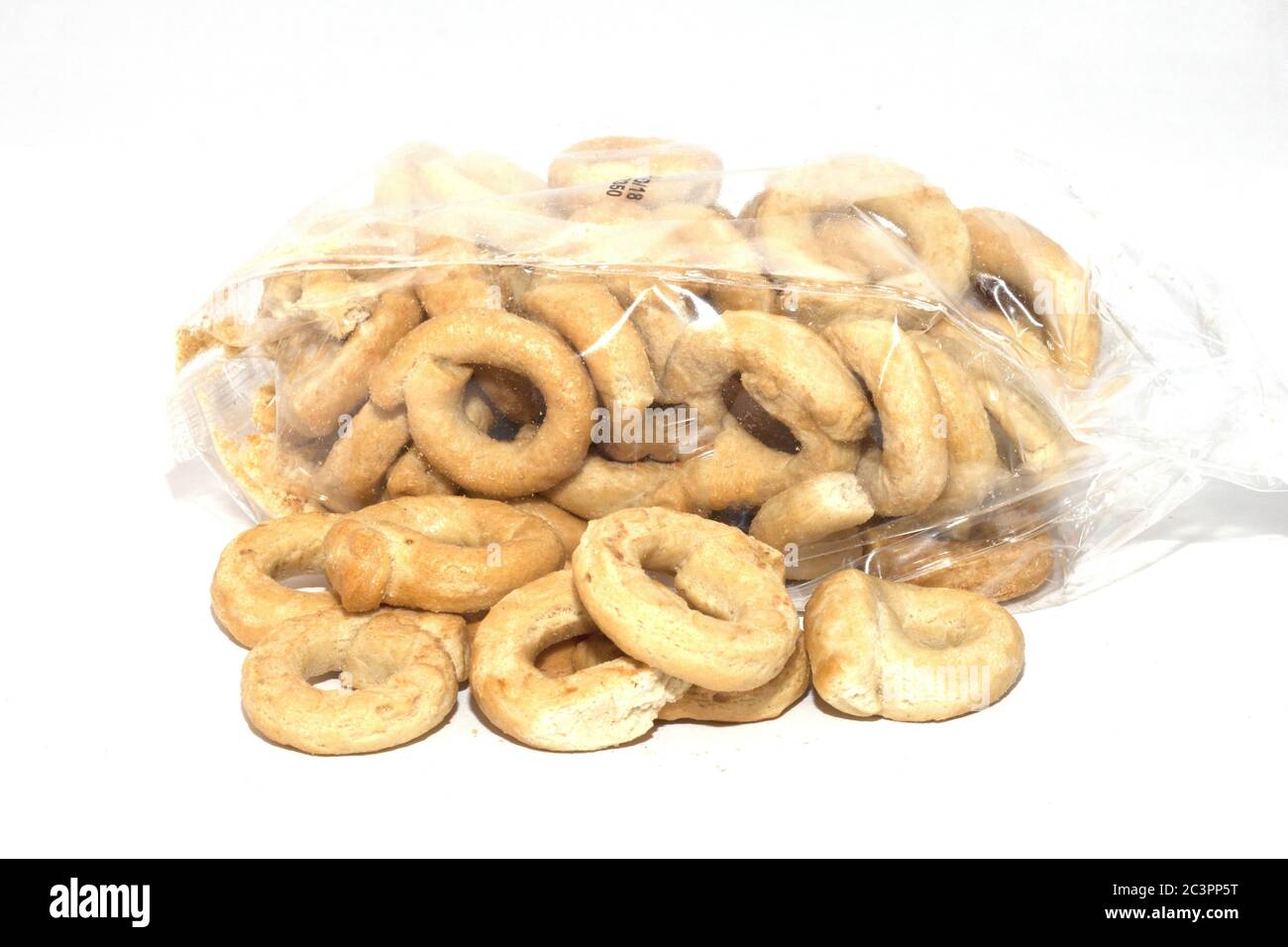 Taralli in a transparent plastic bag packaging isolated on a white ...