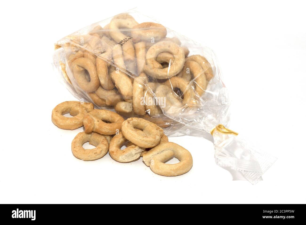 Taralli in a transparent plastic bag packaging isolated on a white ...