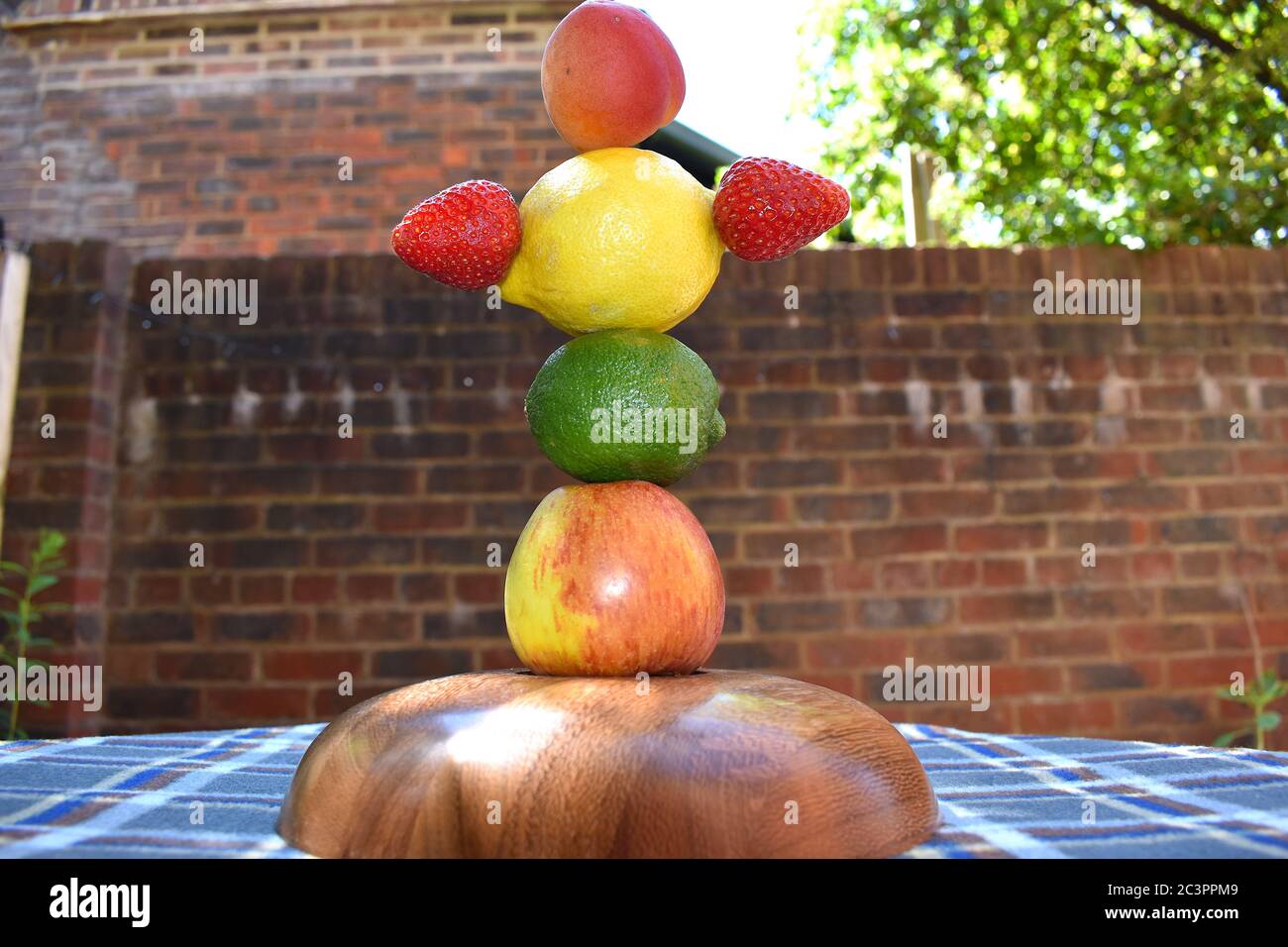 Fresh fruit sculpture. Carving fruits is art technique in Europe and ...