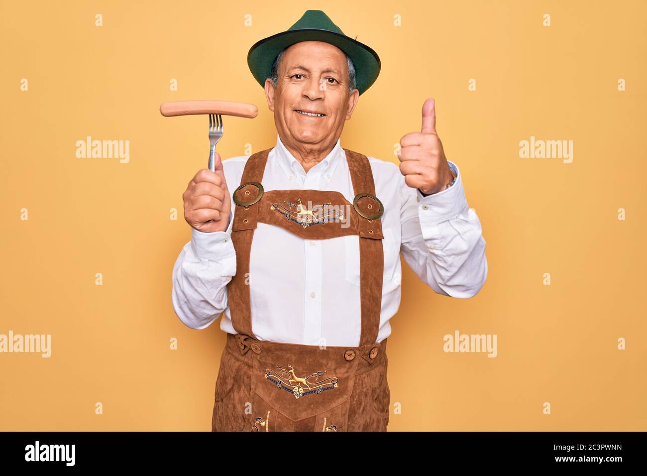 Senior grey-haired man wearing german traditional octoberfest suit ...