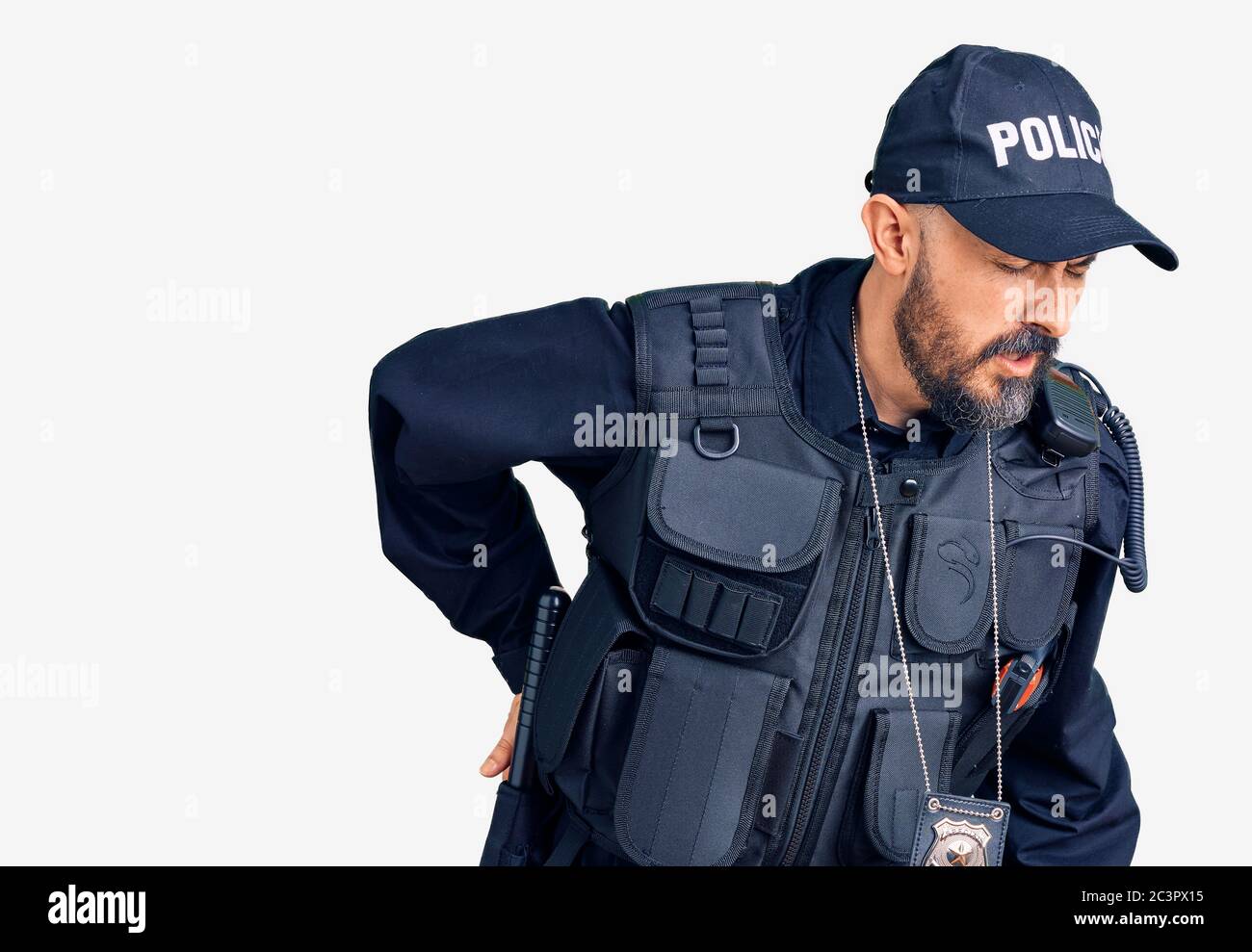 Young handsome man wearing police uniform suffering of backache ...