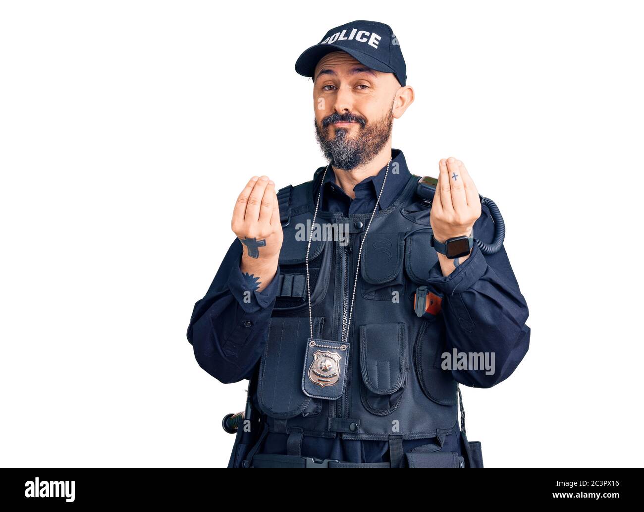 Young handsome man wearing police uniform doing money gesture with ...