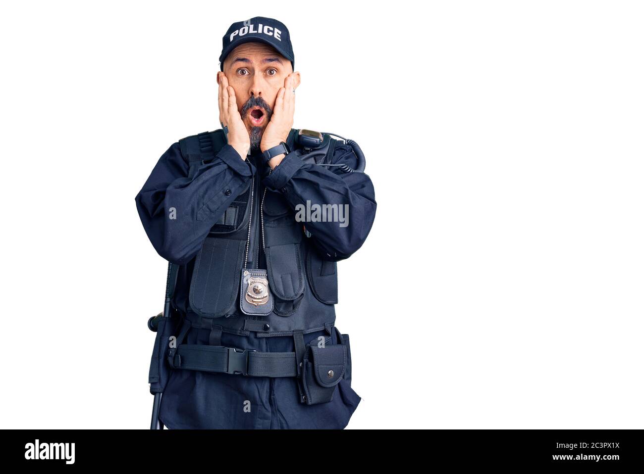 Young handsome man wearing police uniform afraid and shocked, surprise ...