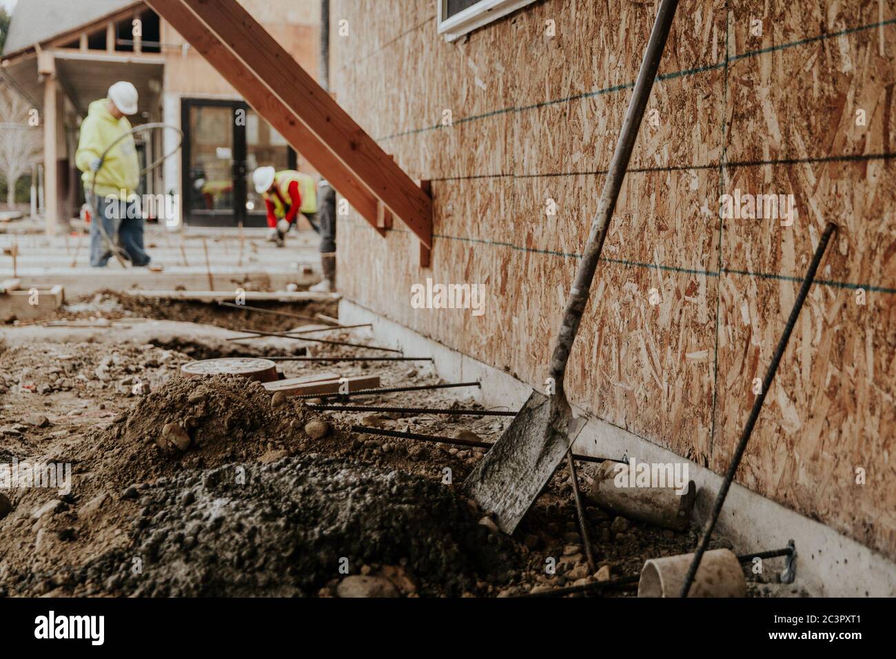 Workers in the construction site Stock Photo - Alamy