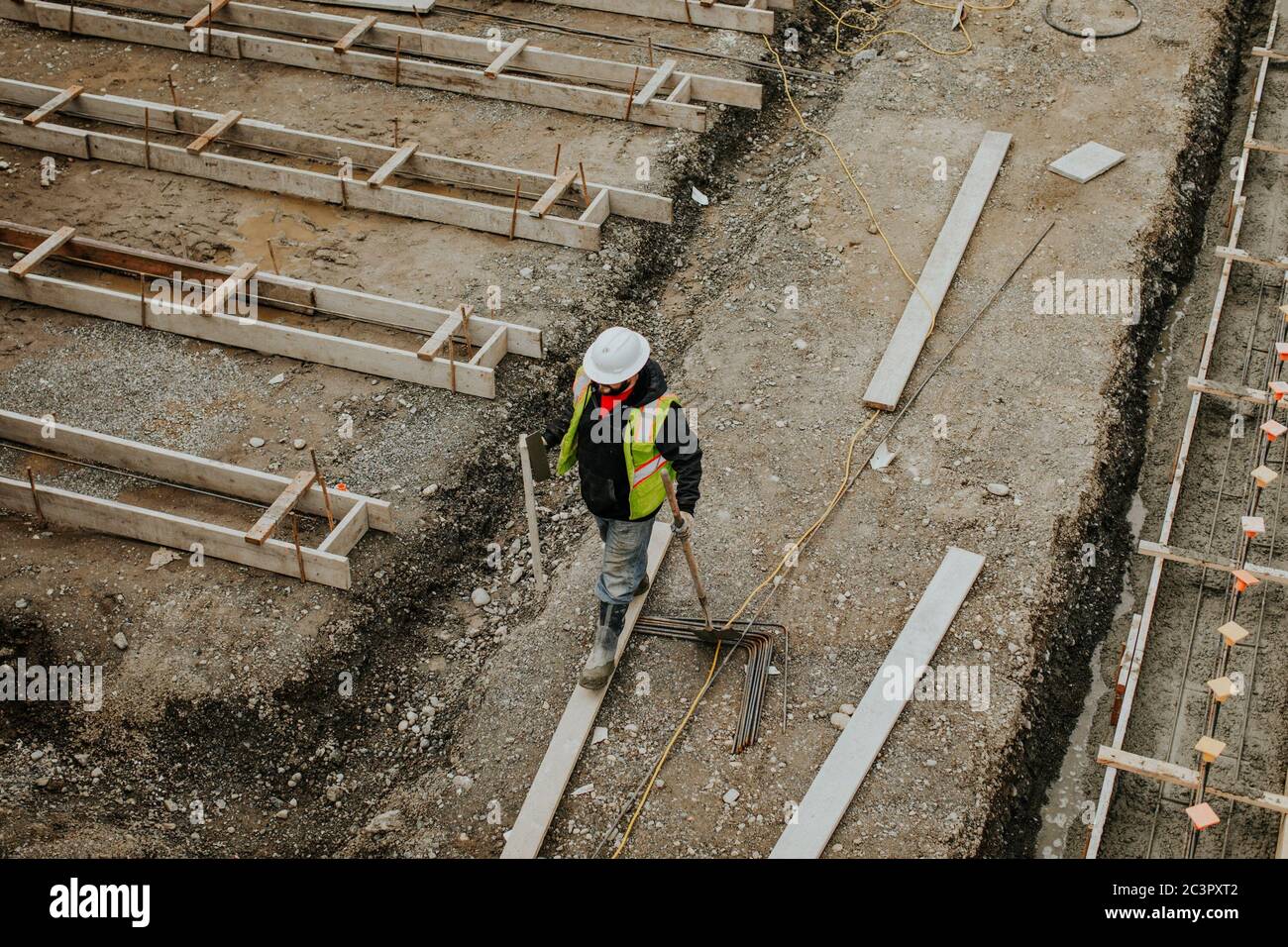 Workers in the construction site Stock Photo - Alamy