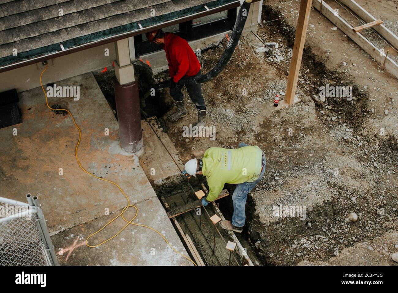 Workers in the construction site Stock Photo - Alamy