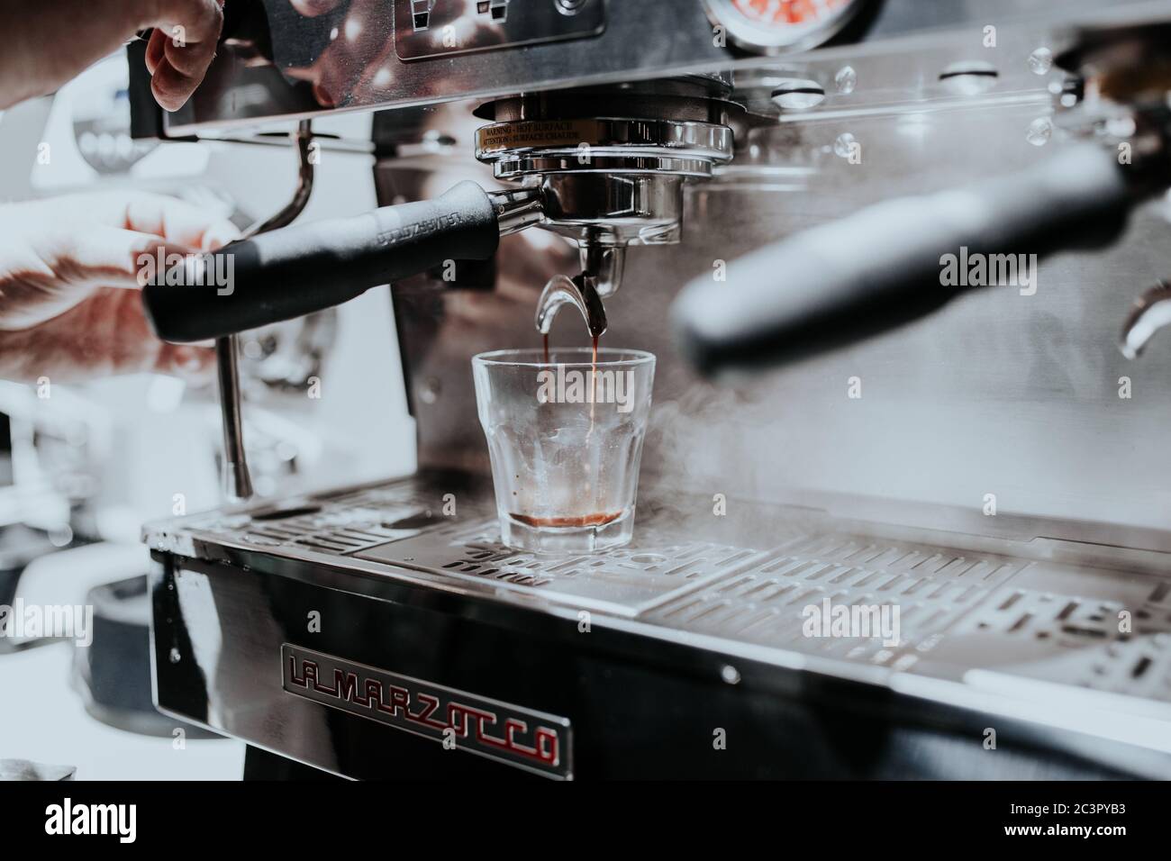 Process of making cappuccino coffee Stock Photo - Alamy