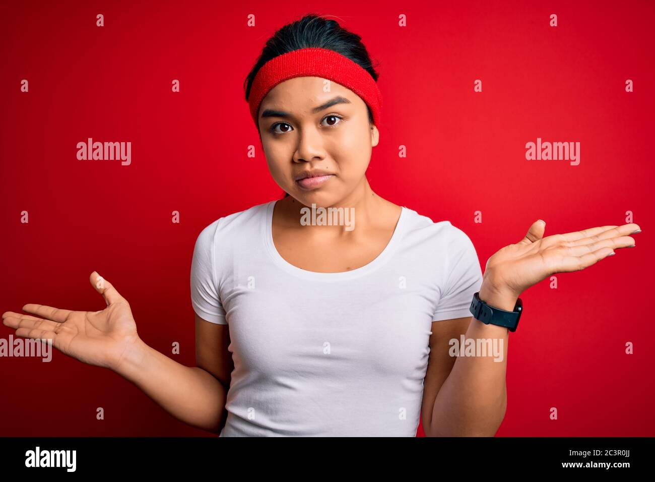 Young beautiful asian sporty woman wearing sportswear doing sport over ...