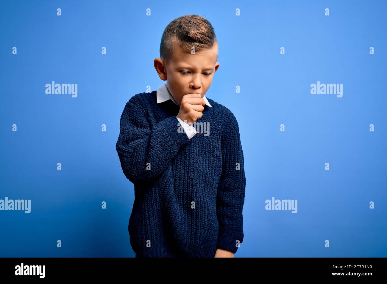 Young little caucasian kid with blue eyes wearing winter sweater over ...