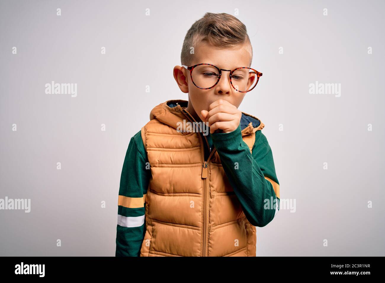 Young little caucasian kid with blue eyes wearing winter coat and smart ...
