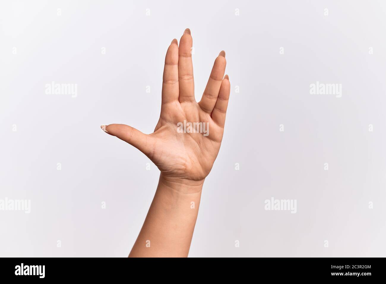 Hand of caucasian young woman greeting doing Vulcan salute, showing ...