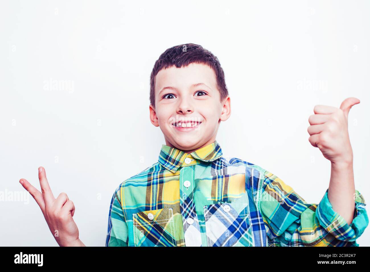 little cute real boy on white background gesture smiling close up ...