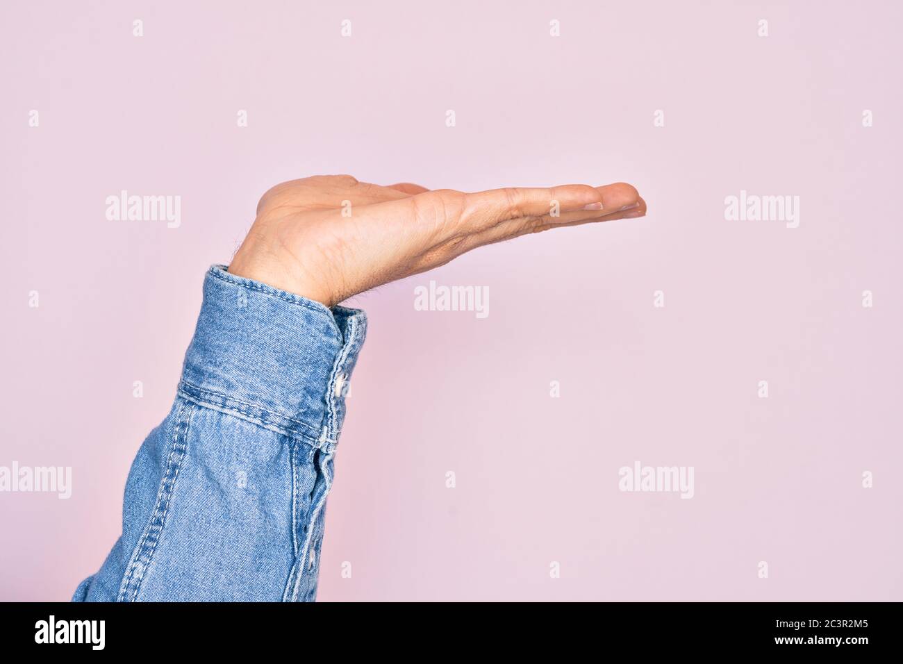 Hand of caucasian young man showing fingers over isolated pink ...